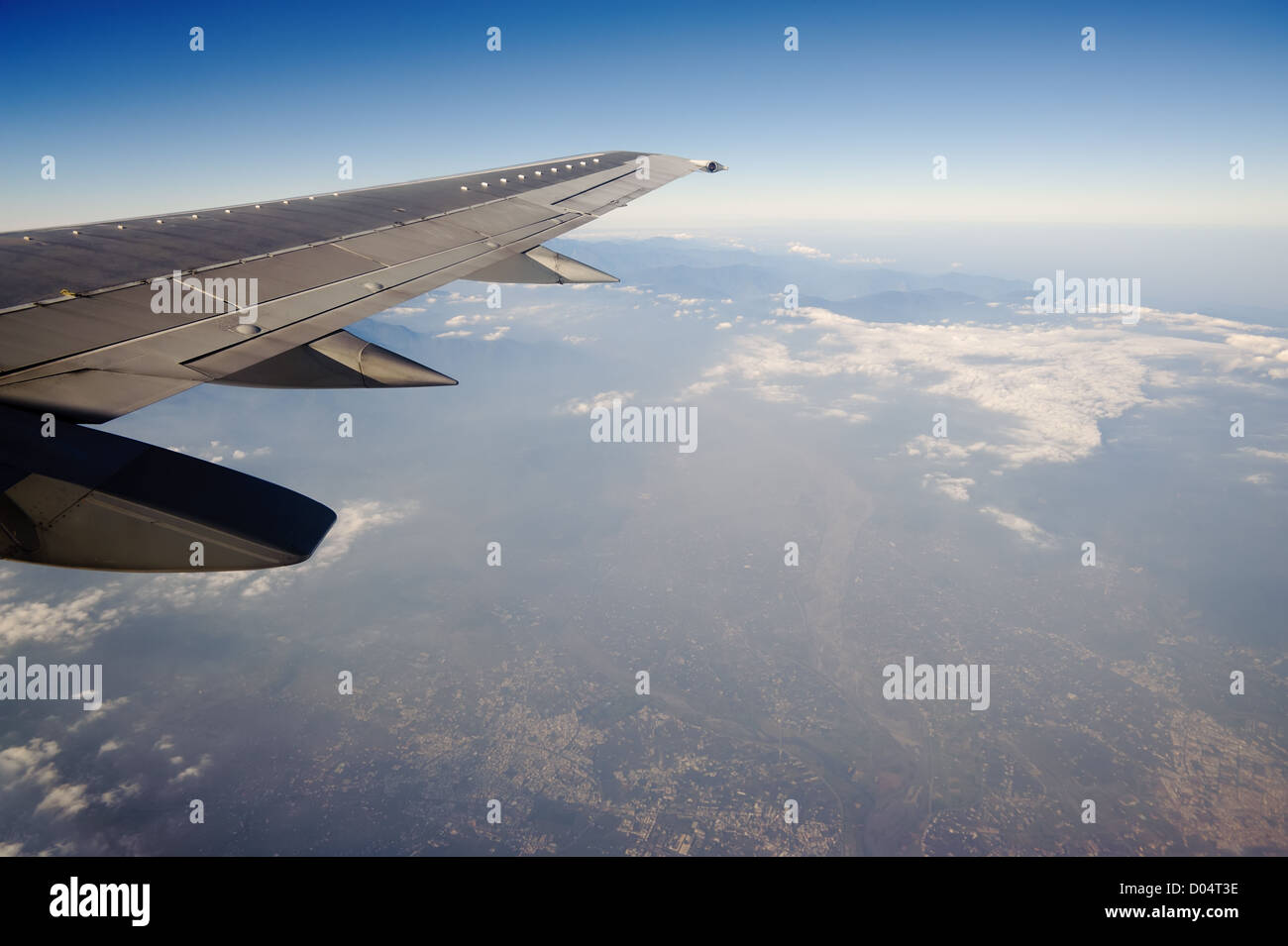 Space view from airline window with blue sky and clouds Stock Photo - Alamy