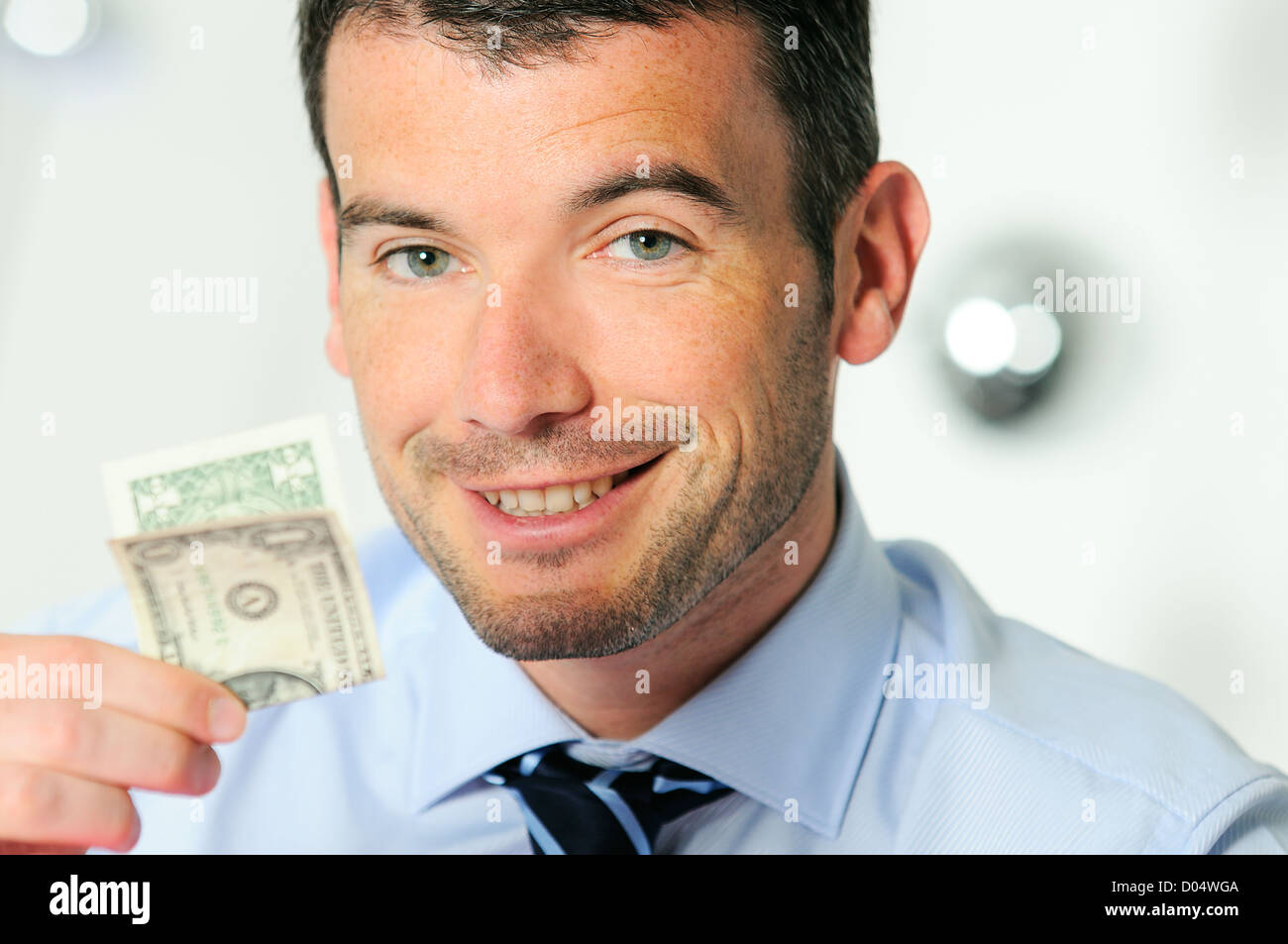 winner and cheerful businessman is showing a dollar Stock Photo - Alamy
