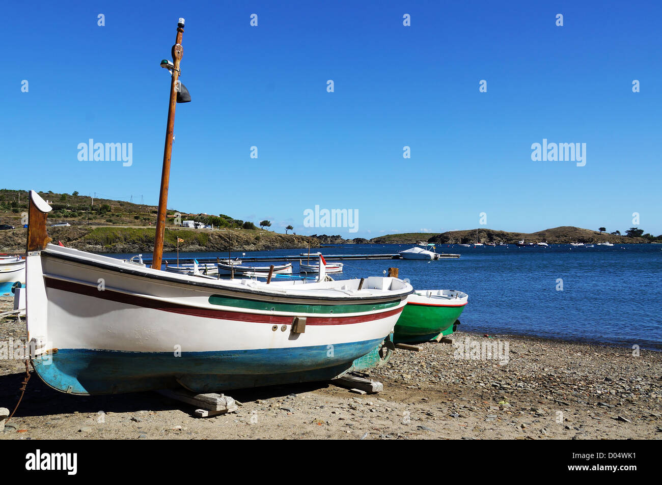 Traditional Catalan boat with Mediterranean sea in background, Cadaques ...