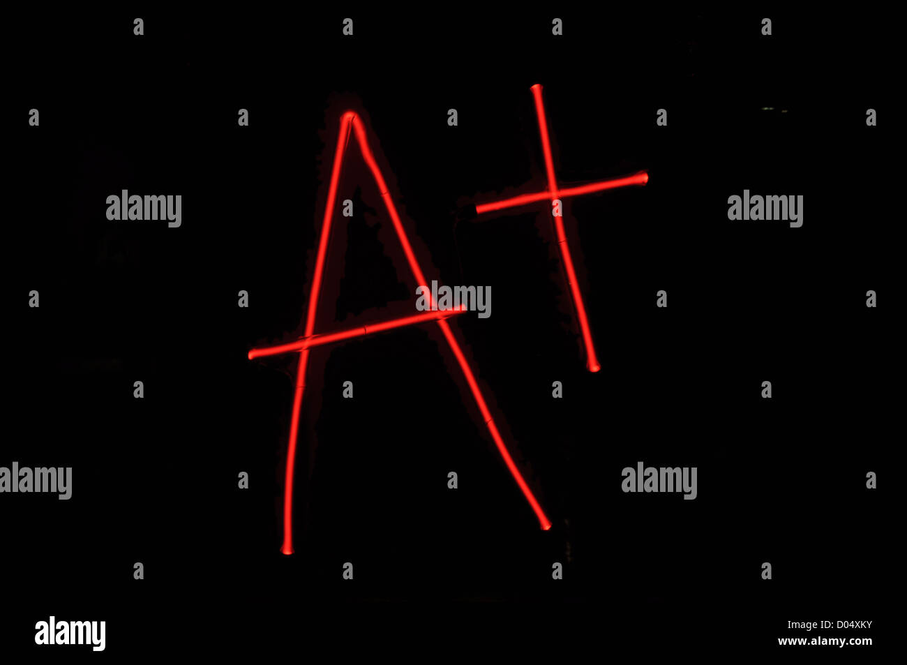 A+ Plus Grade on Neon Red Light Sign Stock Photo - Alamy