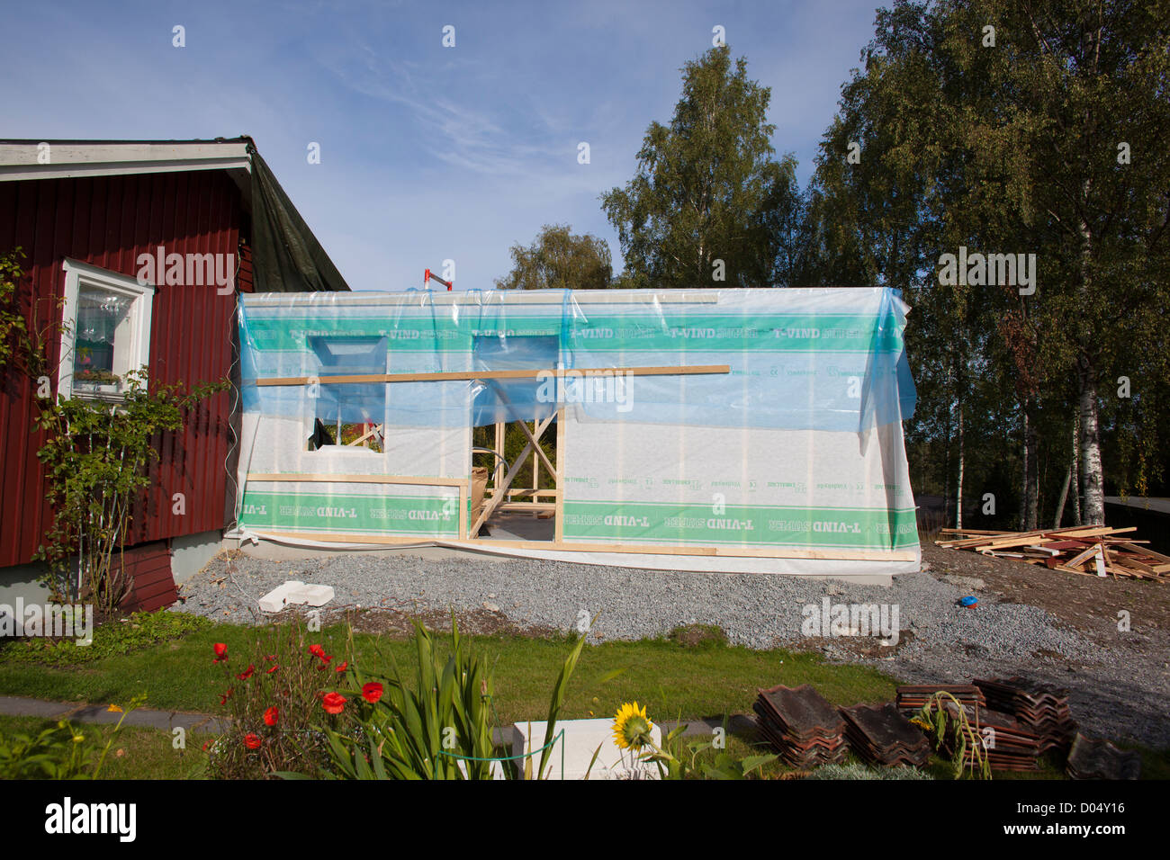 House under construction with rain protector Stock Photo - Alamy