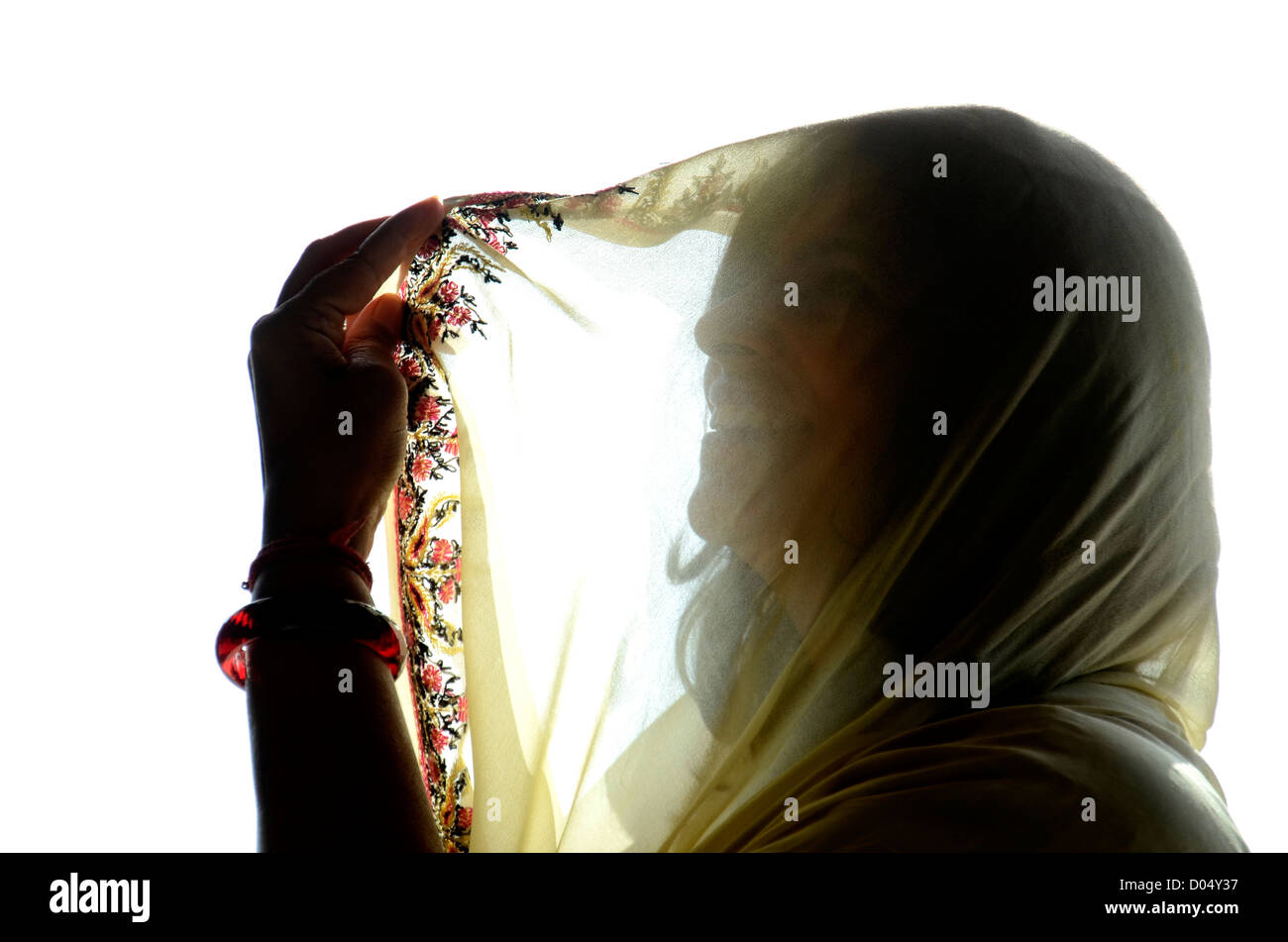 Smiling indian woman behind curtain hi-res stock photography and images ...