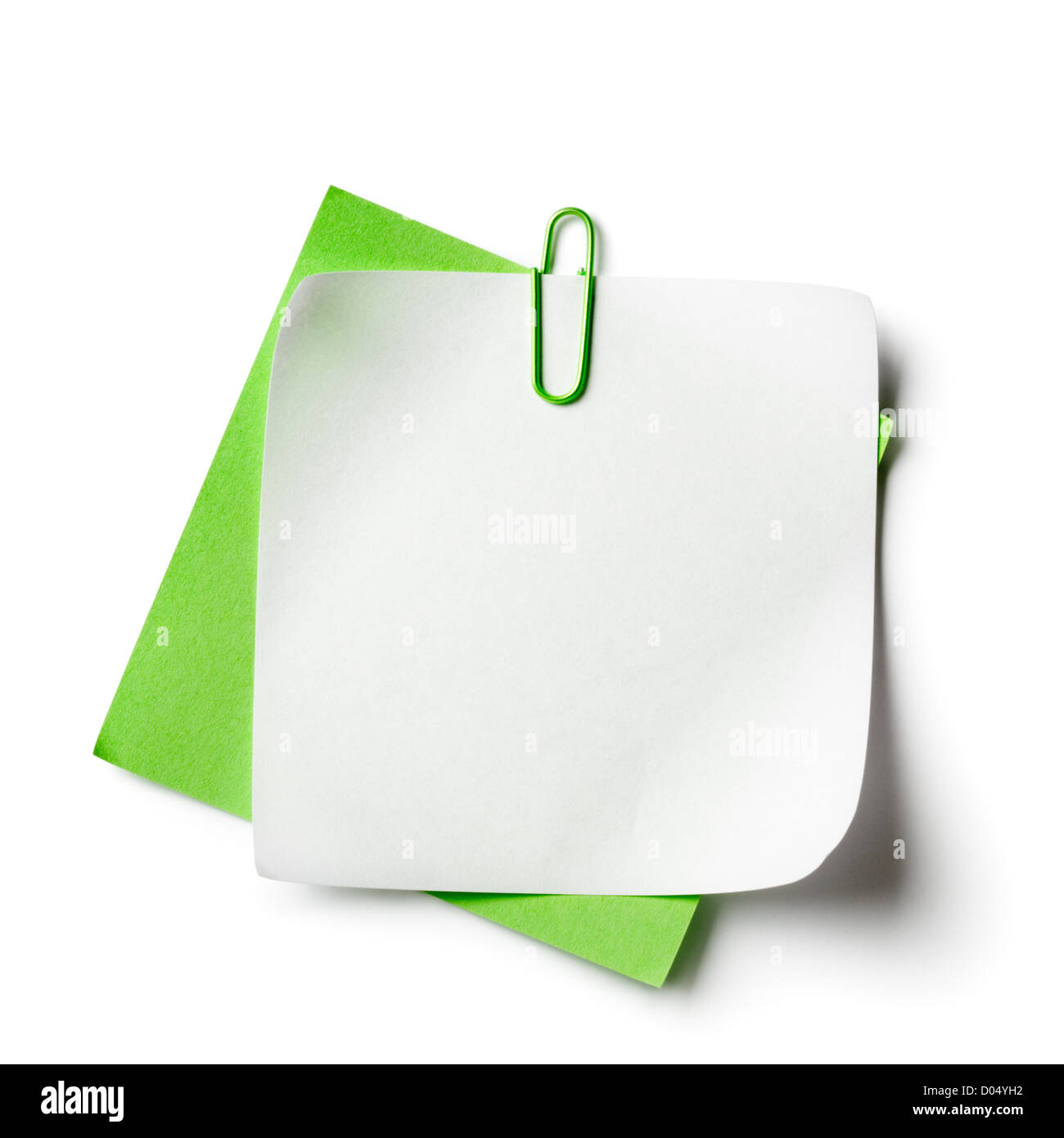 White and green note papers with paperclip on white background Stock ...