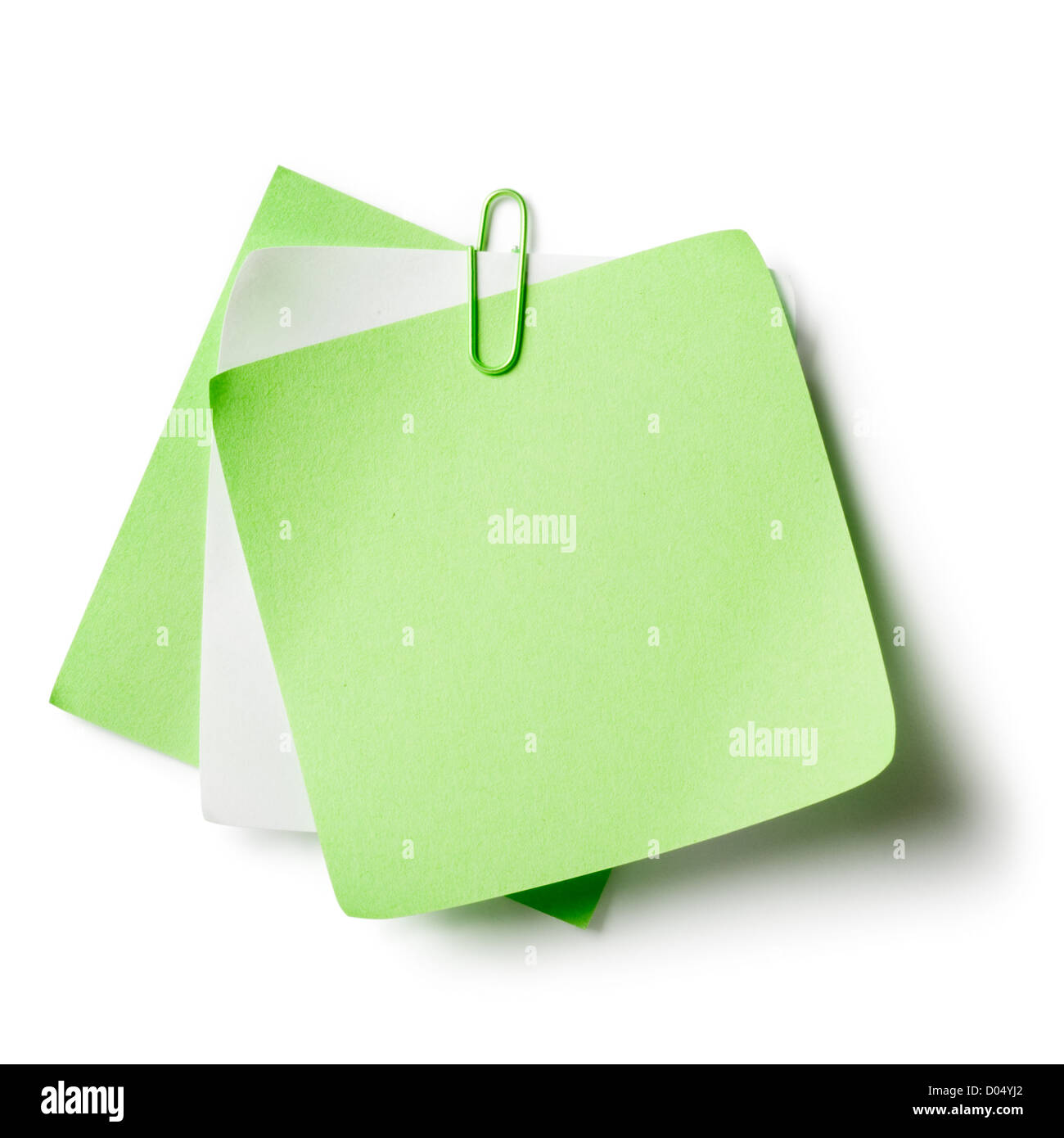 White and green note papers with paperclip on white background Stock ...