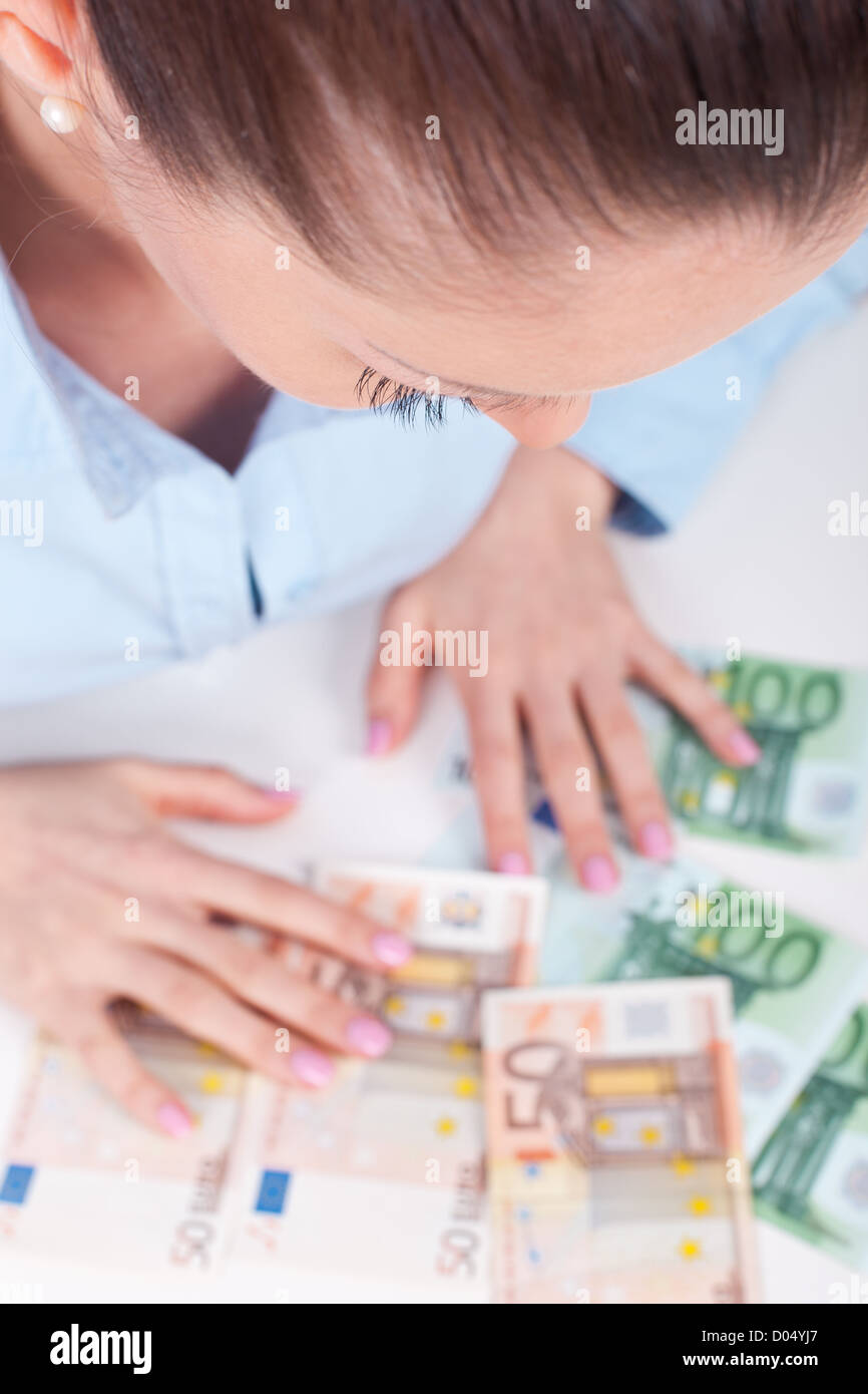 Business woman sitting with cash money, focus on her face Stock Photo ...