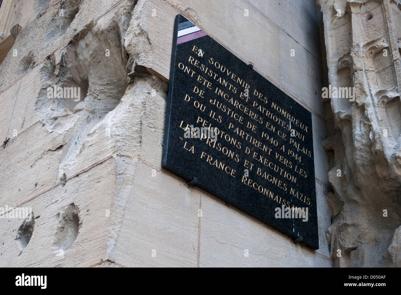 A sign on the shelled Palais de Justice remembering the WW2 resistance ...