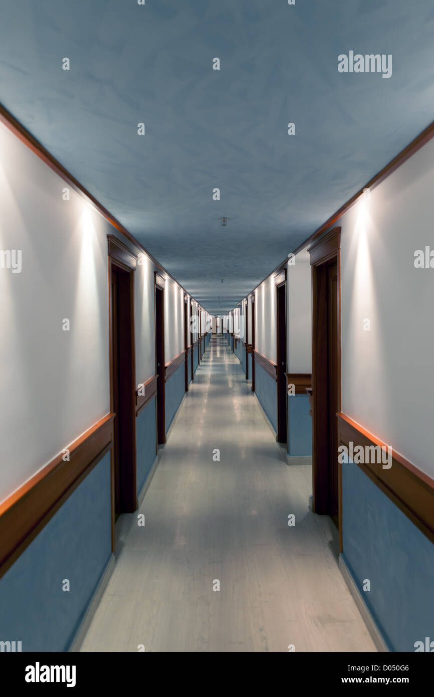 A long corridor has a lot of doors Stock Photo - Alamy