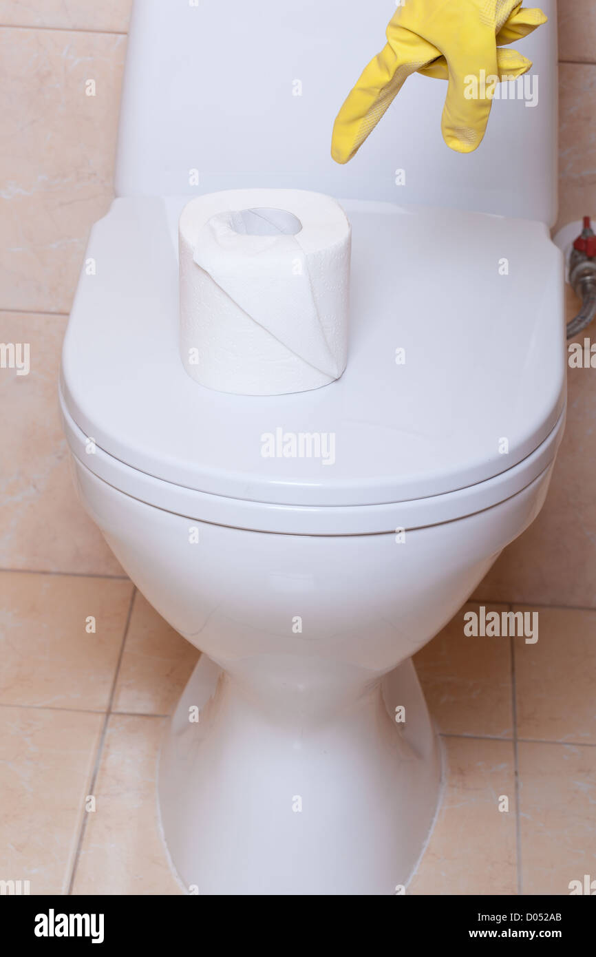 WC hygiene concept, hand in yellow glove making signs Stock Photo - Alamy