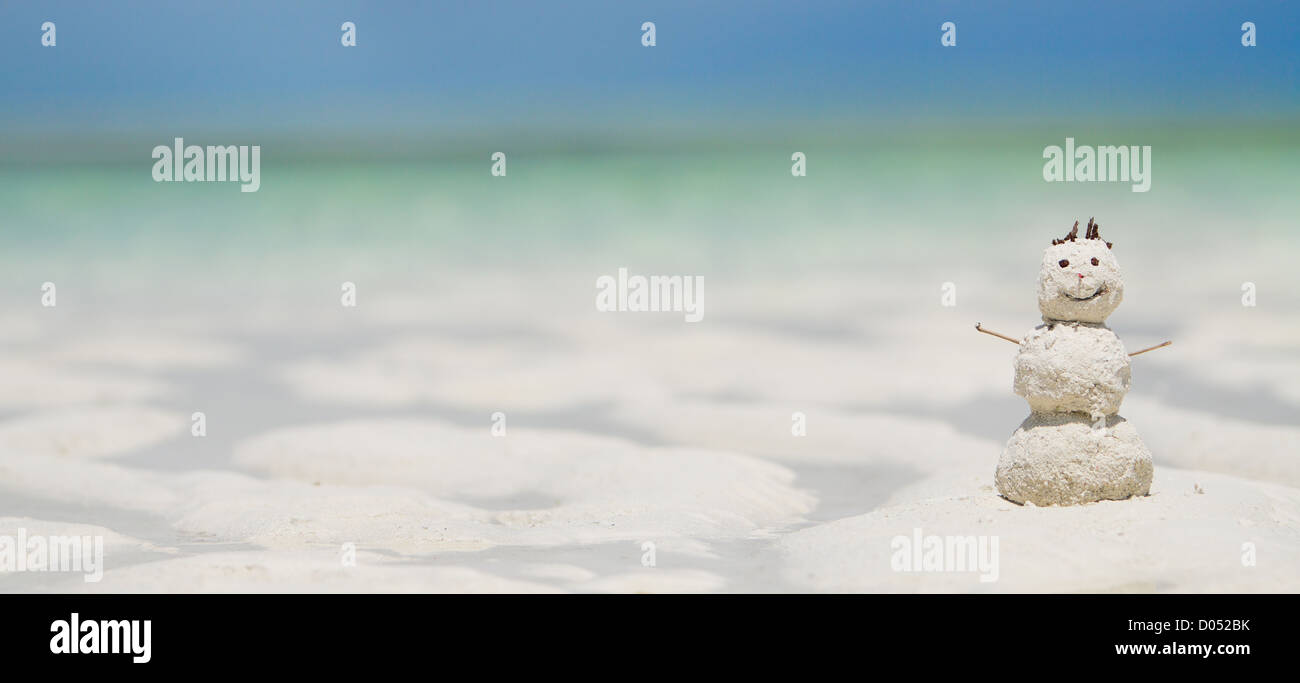 Snowman made from sand on beach Stock Photo - Alamy
