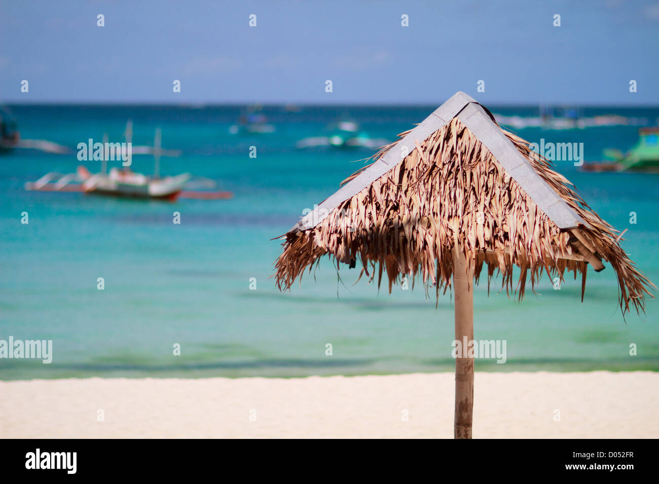 Straw beach umbrella Stock Photo - Alamy
