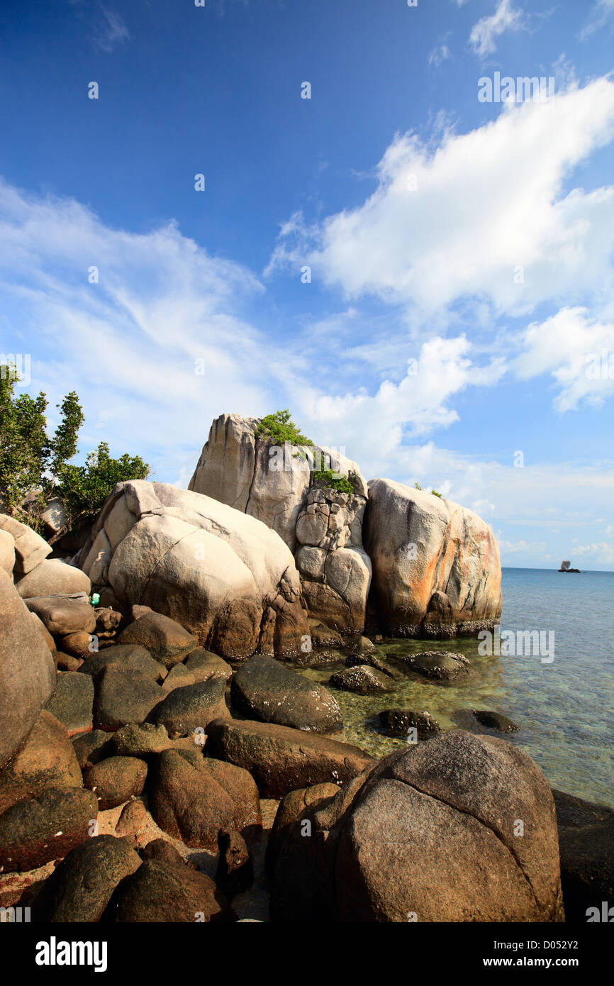 Rocky coast in Indonesia Stock Photo - Alamy