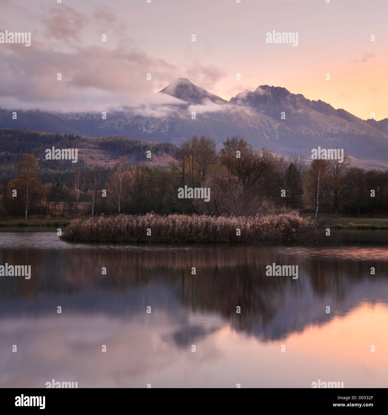 Early morning light over the fishing pond at Tatranska Strbe in the ...