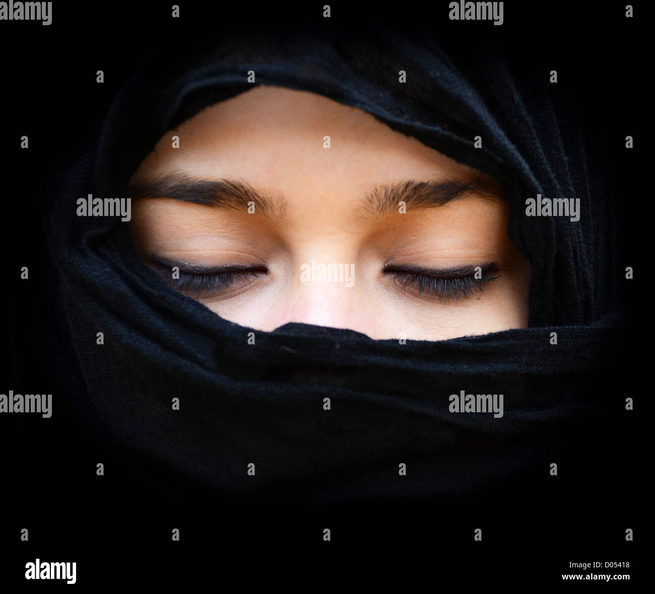 Portait of woman wearing scarf with eyes closed Stock Photo - Alamy