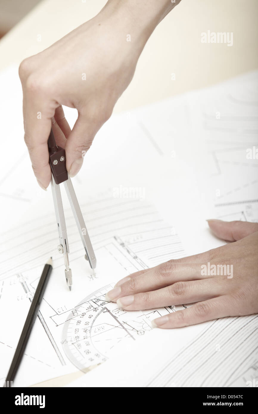 Hands of engineer working on a construction plan Stock Photo - Alamy