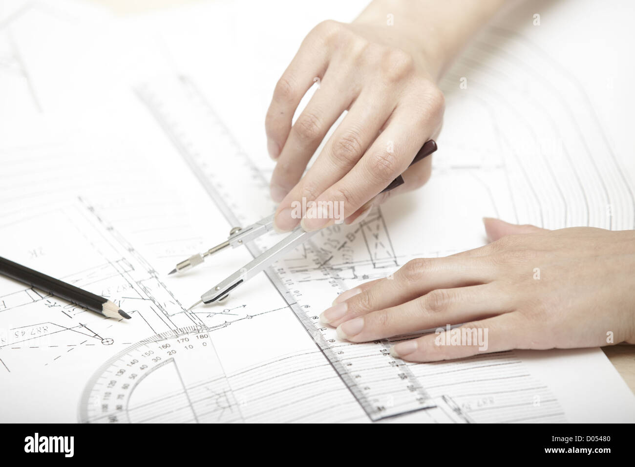 Hands of engineer working on a construction plan Stock Photo - Alamy