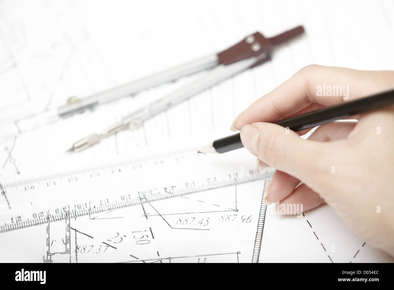 Hand of engineer working on a construction plan Stock Photo - Alamy