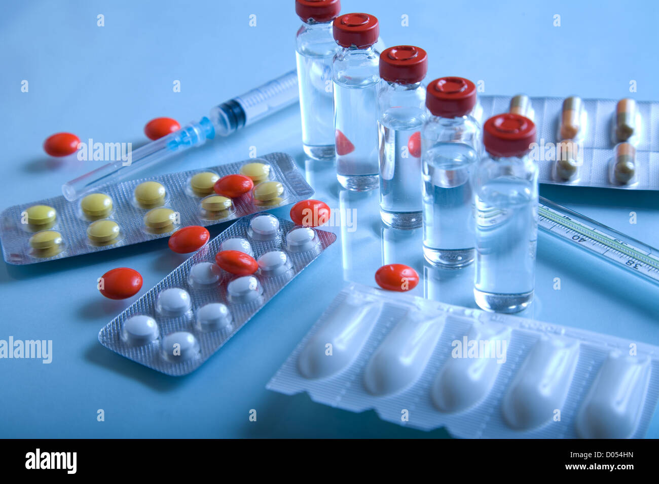 Pharmaceutical products - syringe and pills Stock Photo - Alamy
