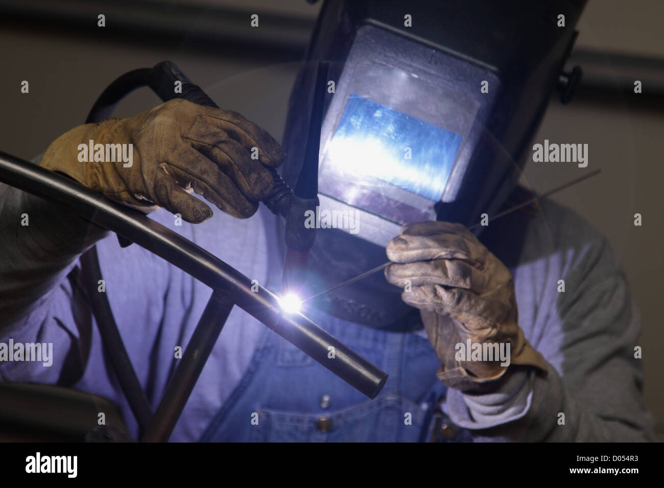 Worker welding steel at work Stock Photo - Alamy