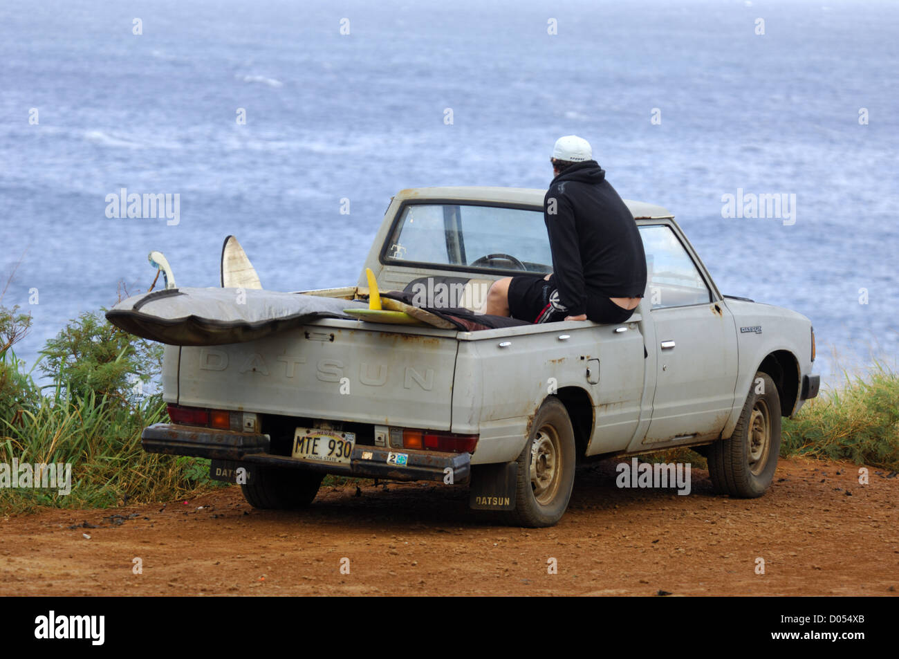 Surfer sitting in truck and watching the waves at Honolua Bay Maui ...