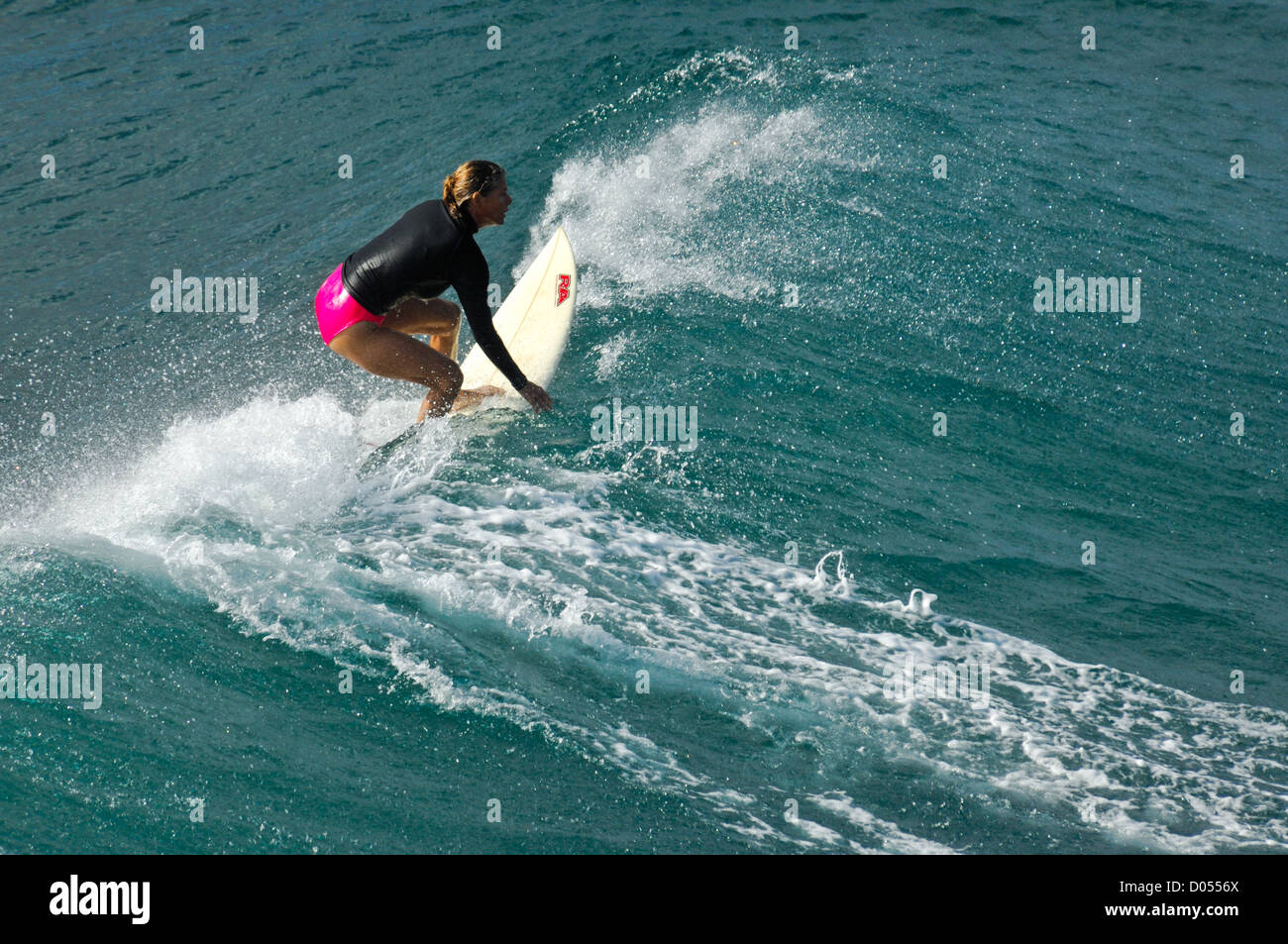 Girl surfing at Honolua Bay Maui Hawaii Stock Photo - Alamy