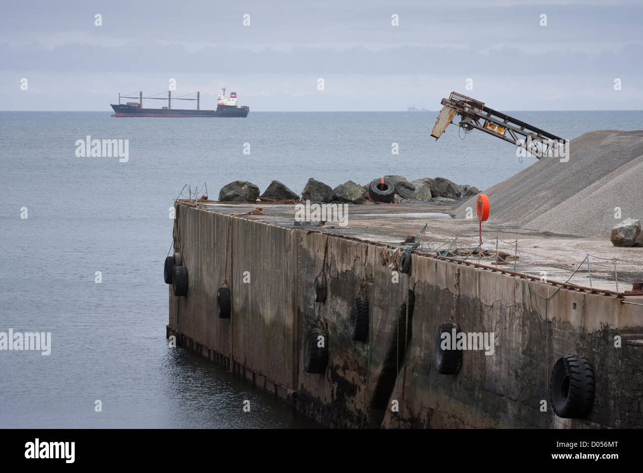 quarry quayside with ship in distance Stock Photo - Alamy