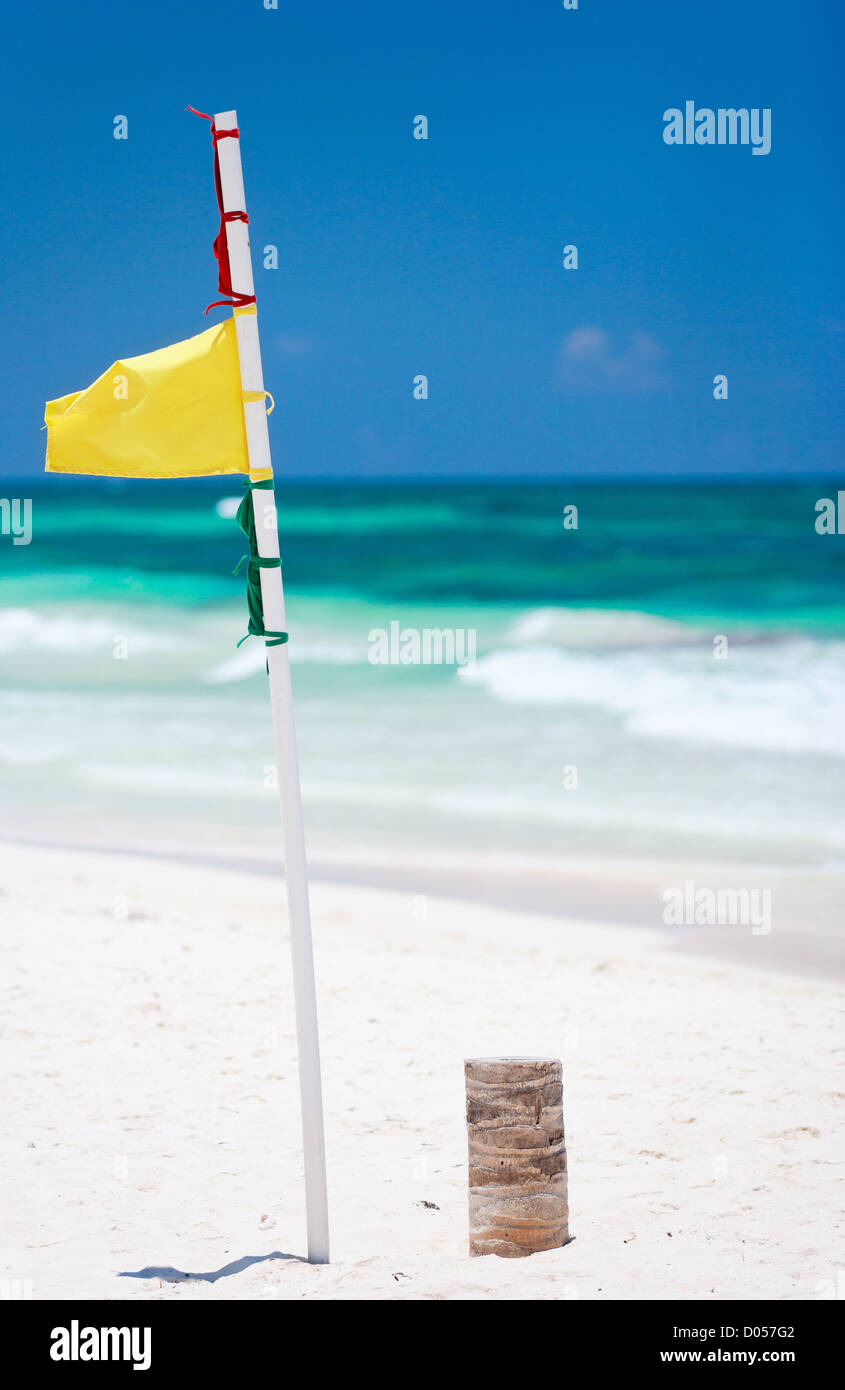 Yellow warning flag at beach Stock Photo - Alamy