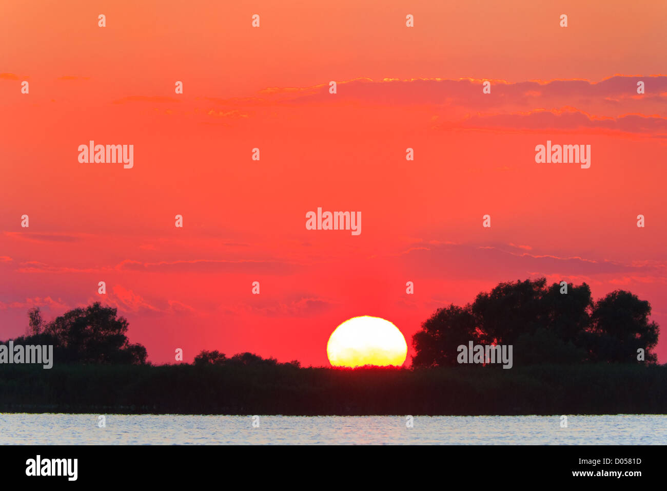sunset in the Danube Delta Stock Photo - Alamy