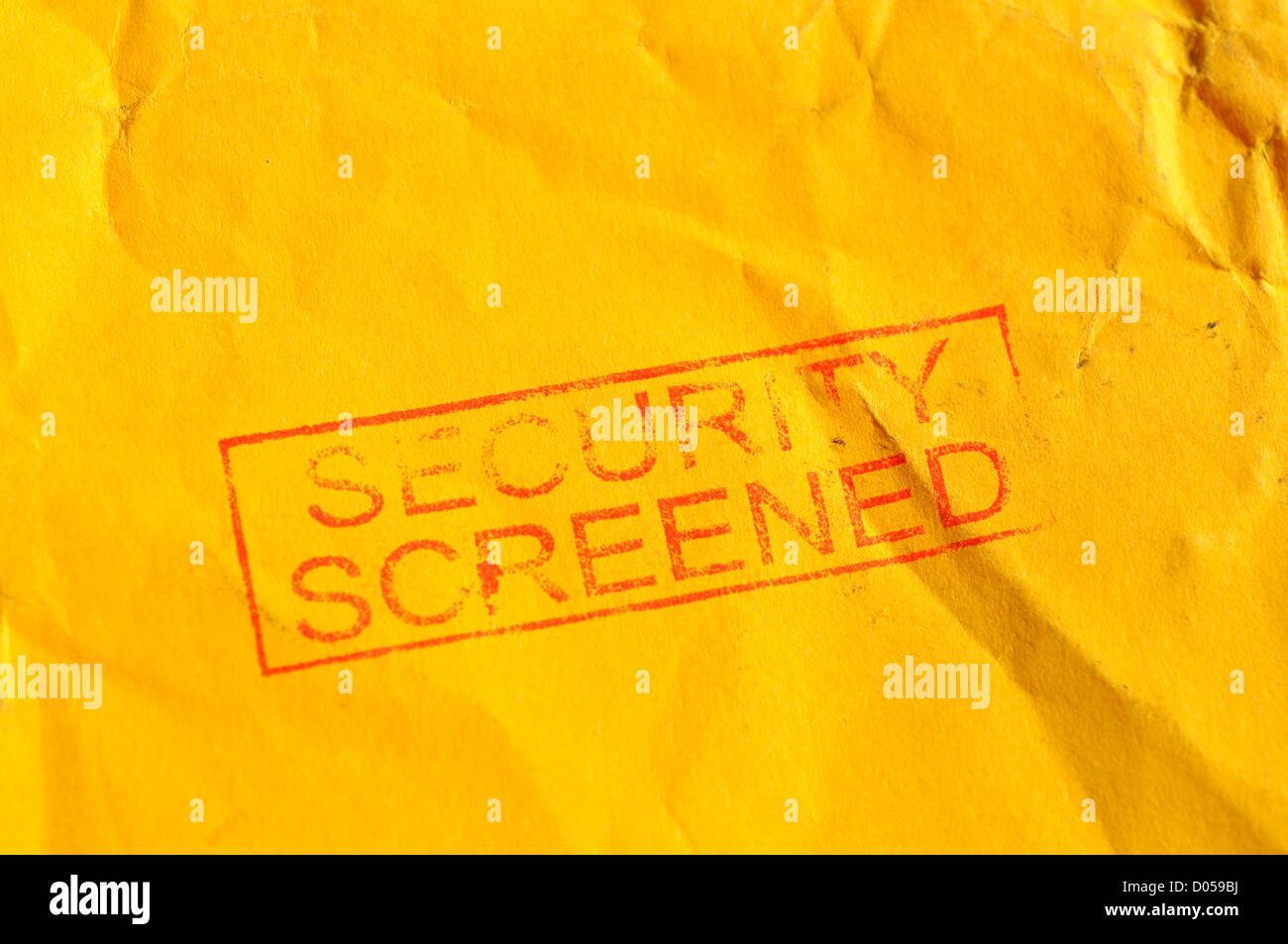 SECURITY SCREENED stamp on mail package envelope Stock Photo - Alamy
