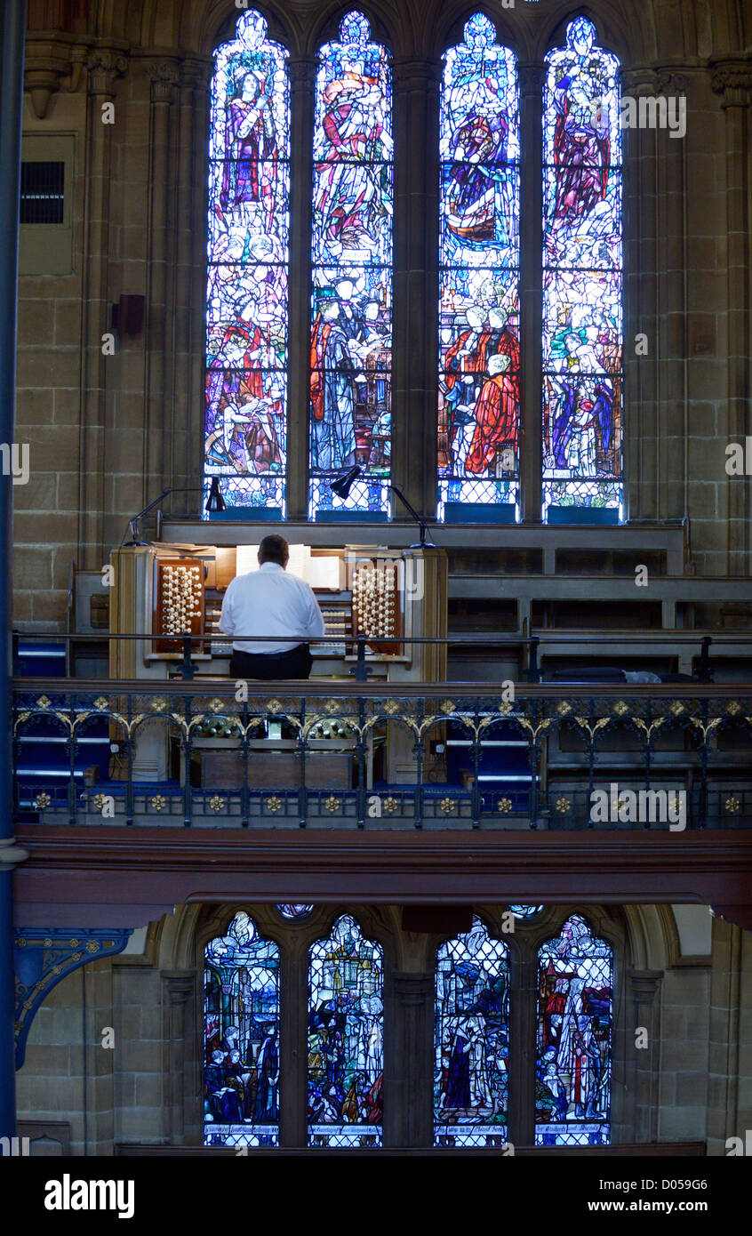 Organist playing an organ in church Stock Photo - Alamy