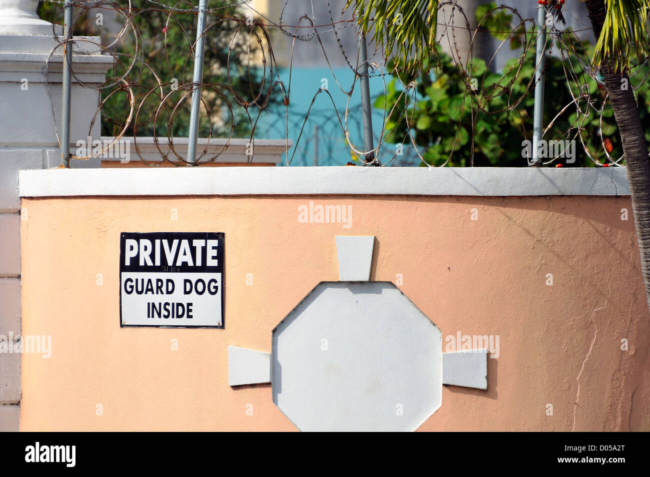 Private, guard dog sign on local house wall Stock Photo - Alamy