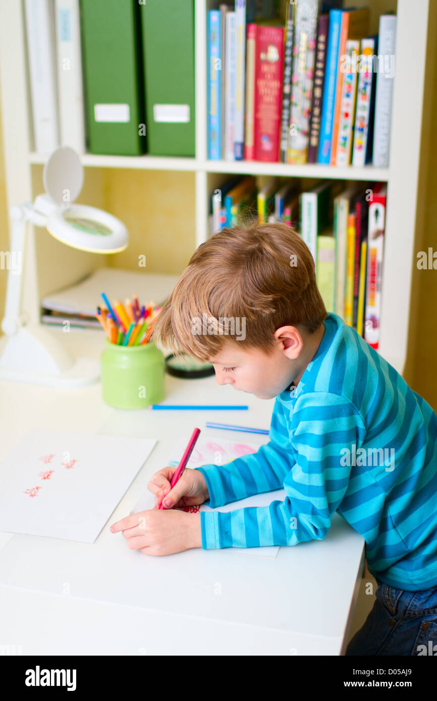 Little boy studying at home Stock Photo - Alamy