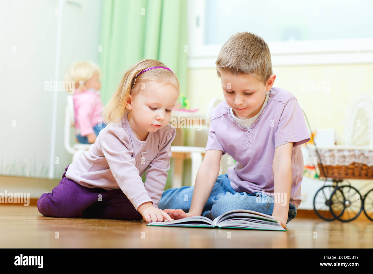 Brother and sister reading Stock Photo - Alamy