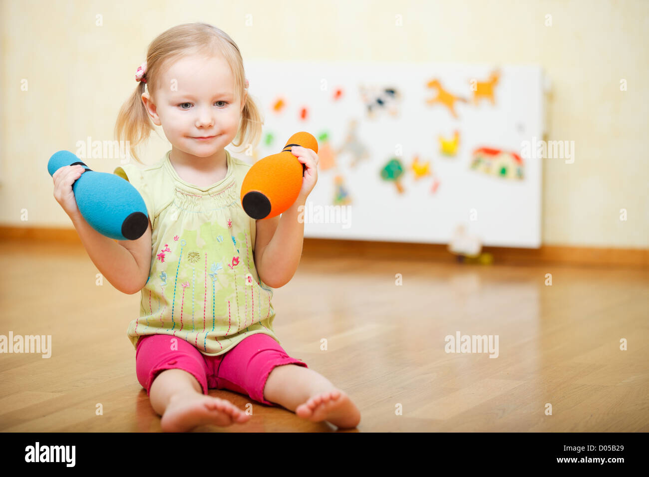 Toddler girl playing Stock Photo - Alamy