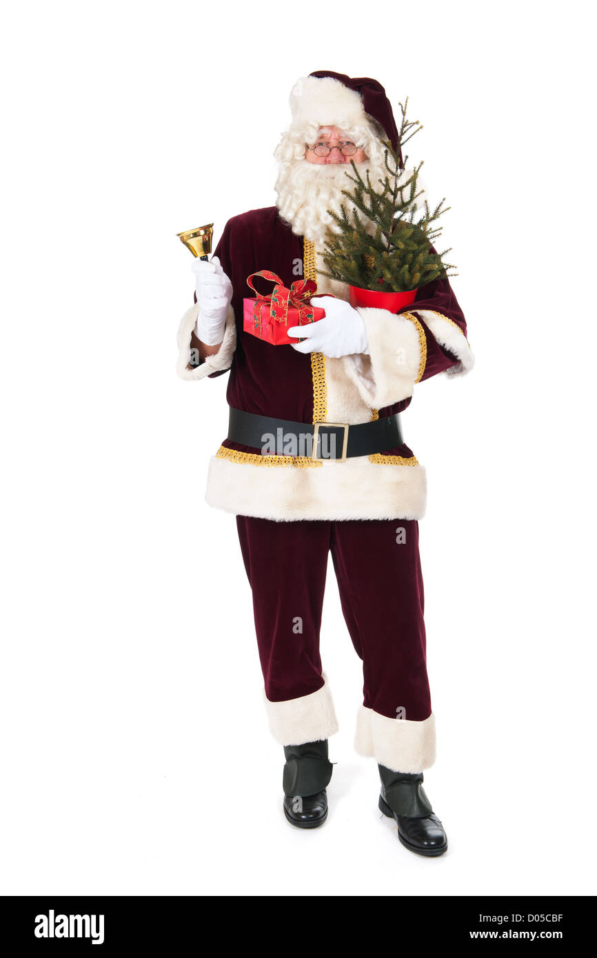 Santa Claus with Christmas tree and copper bell isolated over white ...