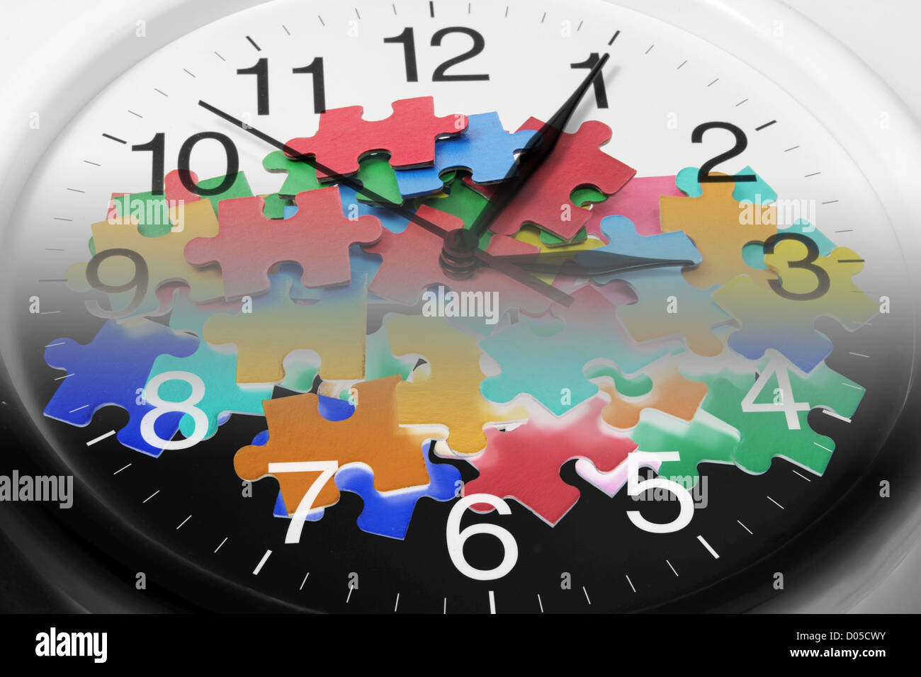 Clock and Jigsaw Puzzle Pieces Stock Photo - Alamy