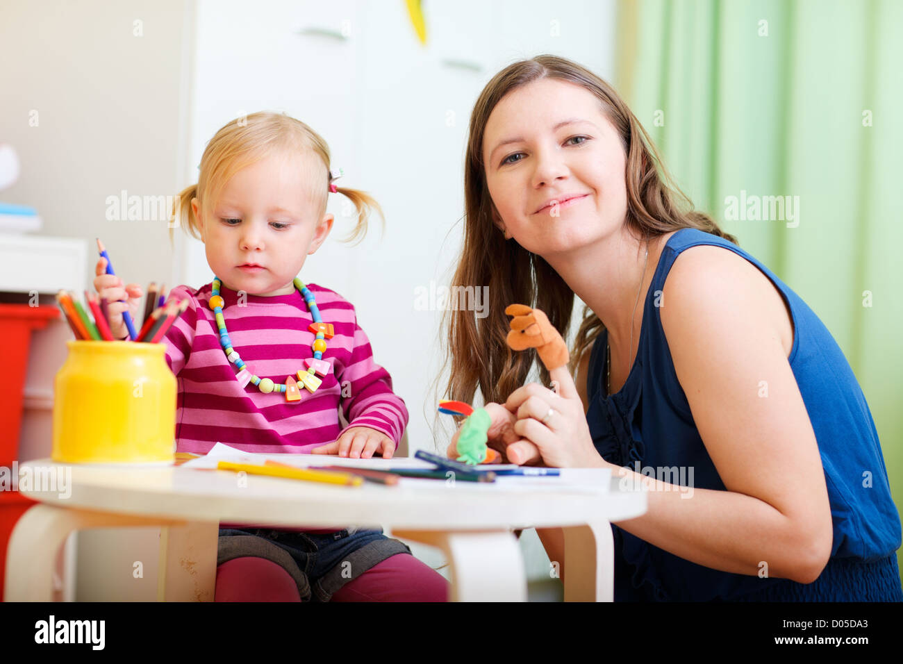Mother and daughter playing together Stock Photo - Alamy