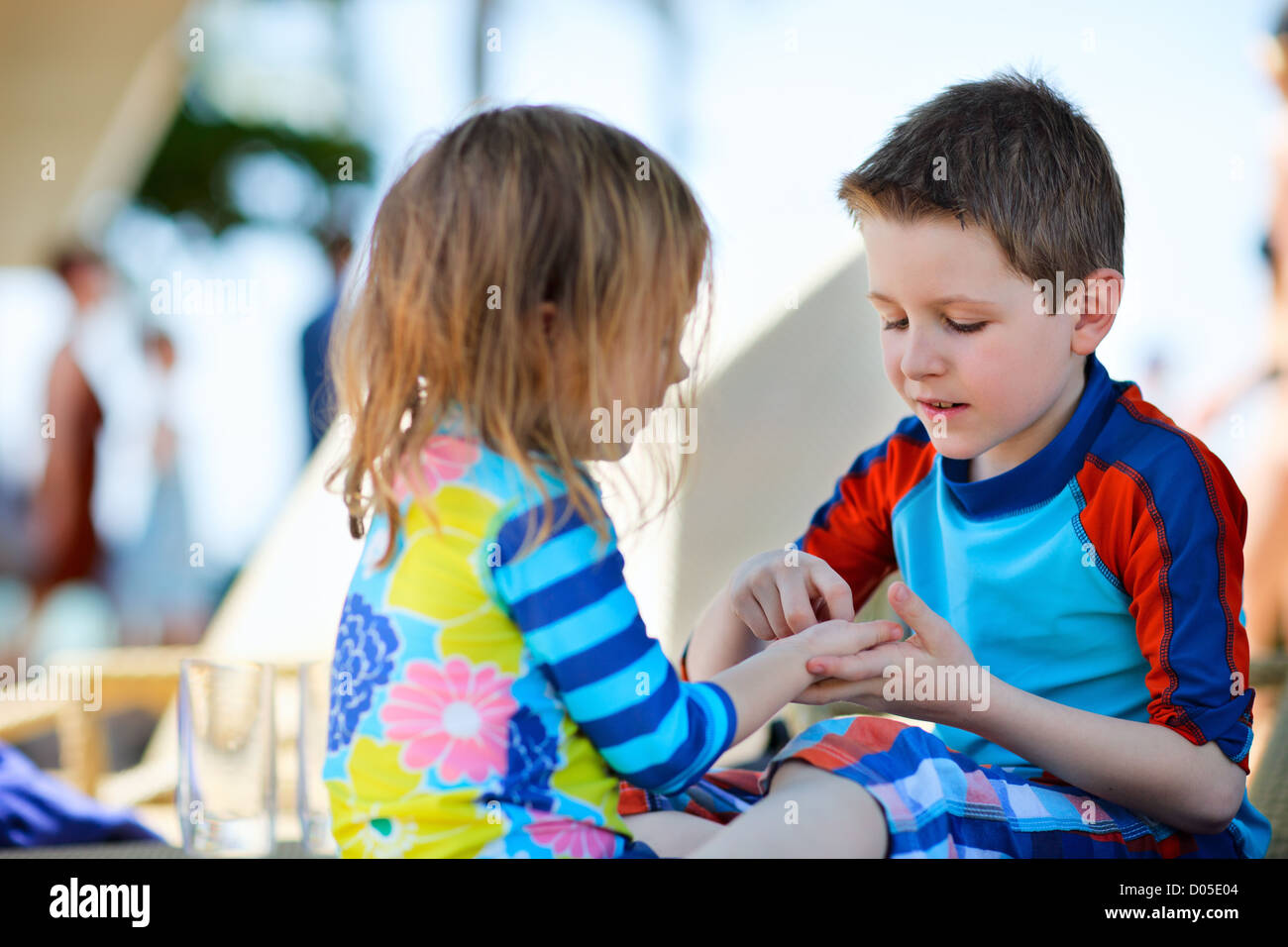 Two kids playing together Stock Photo - Alamy