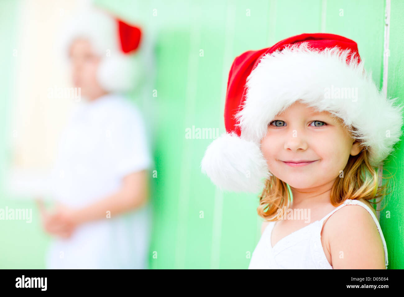 Little girl in Santa hat Stock Photo - Alamy