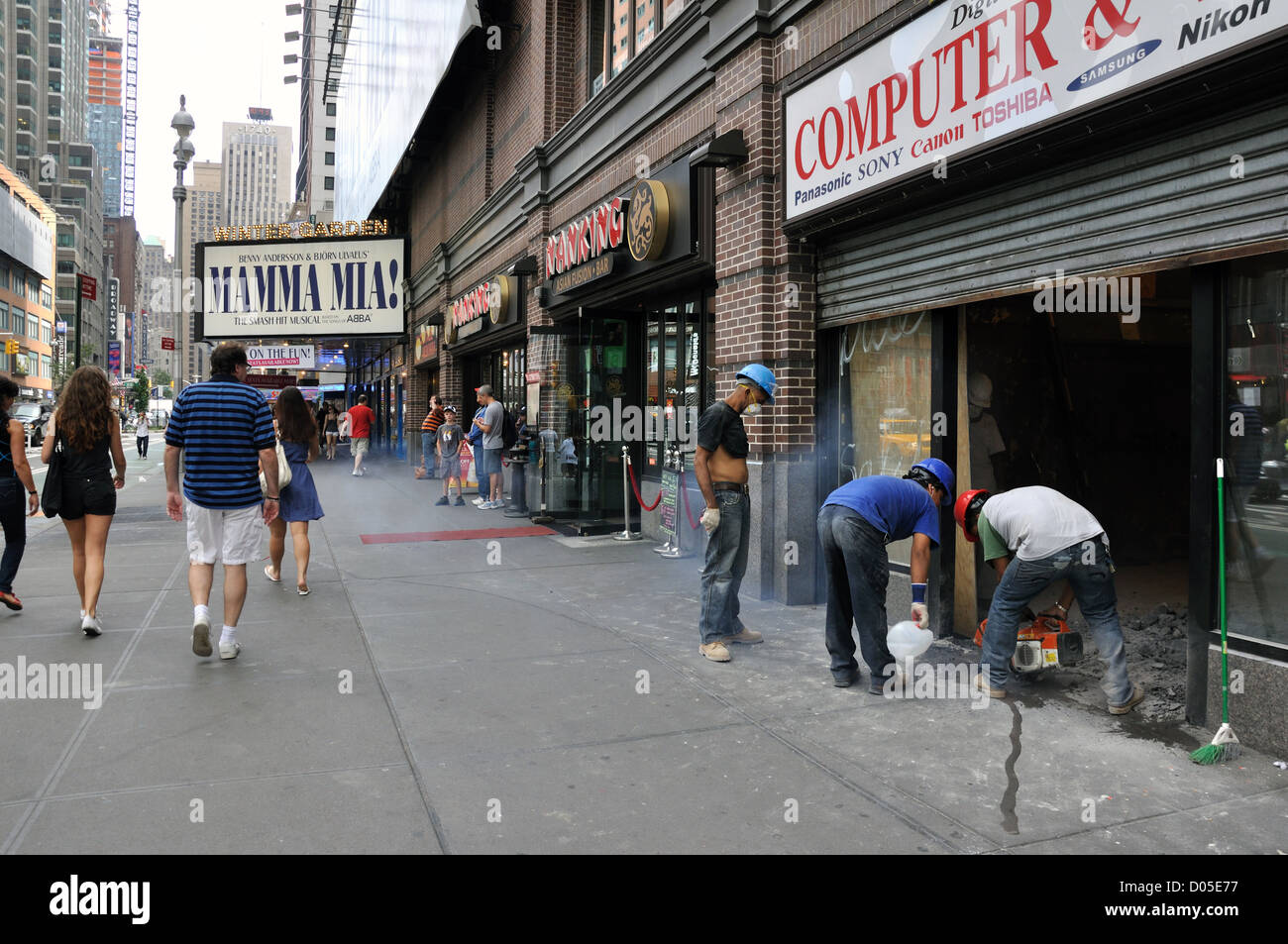 Workers repairing storefront, New York City, USA Stock Photo - Alamy