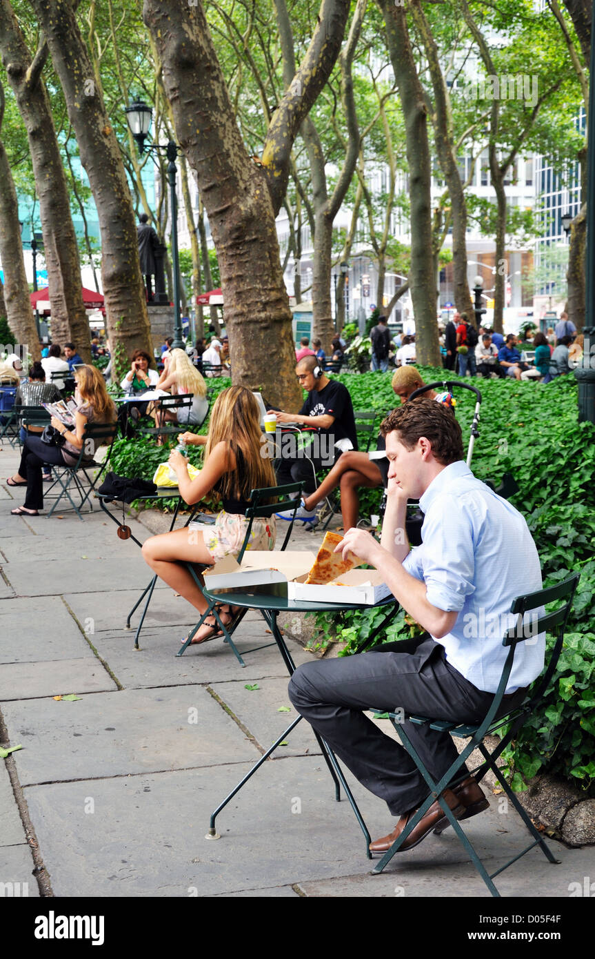 People sitting at an outdoor cafe table in park, New York, USA Stock ...