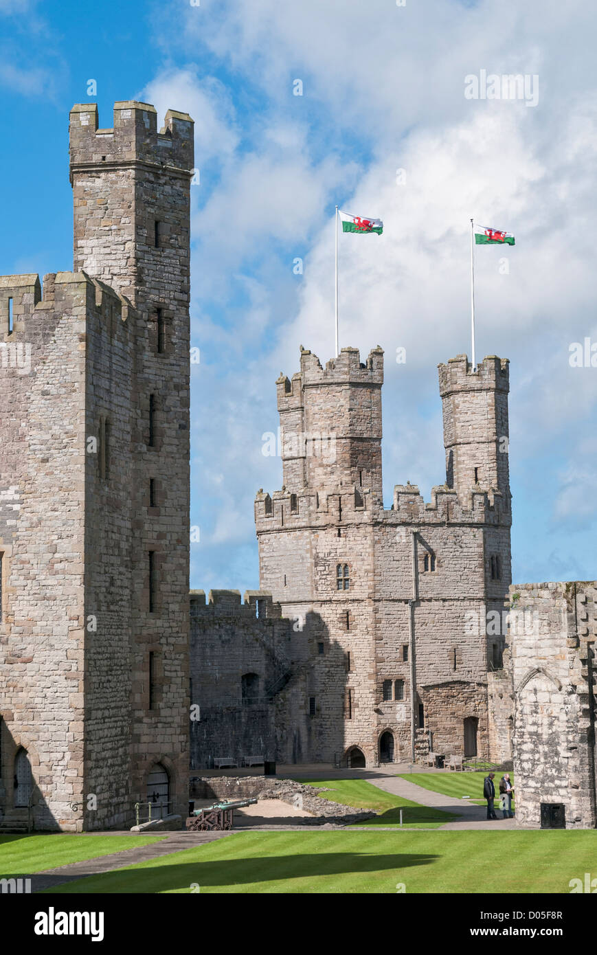 Wales, County Gwynedd, Caernarfon Castle, Welsh flags atop Eagle Tower ...