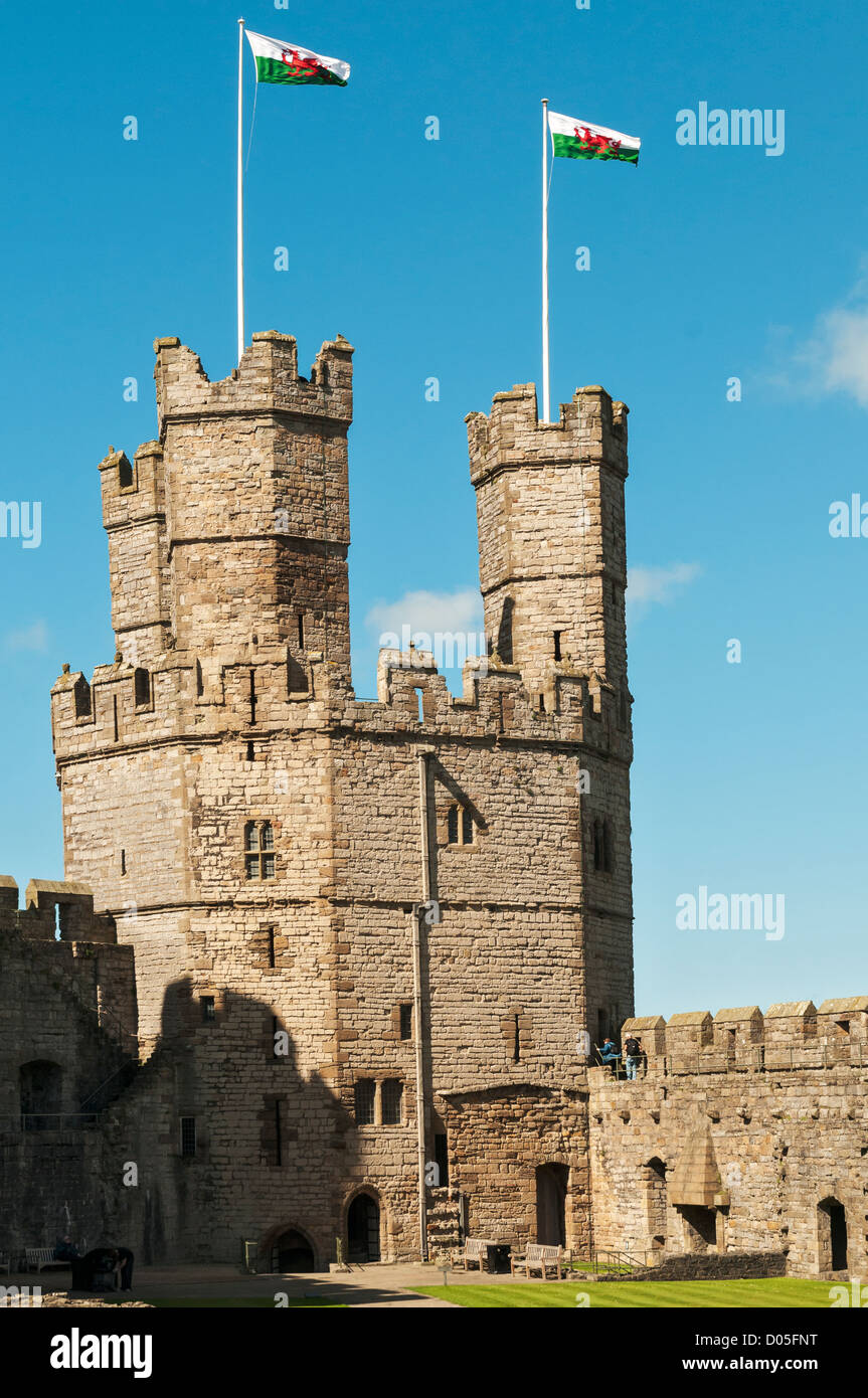 Wales, County Gwynedd, Caernarfon Castle, Welsh flags atop Eagle Tower ...