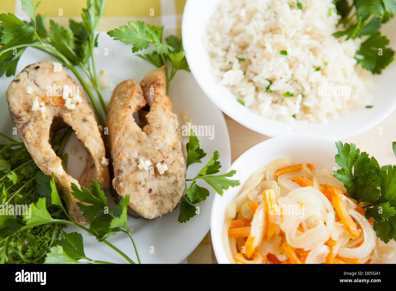 Grilled fish with rice and vegetables, close up Stock Photo - Alamy