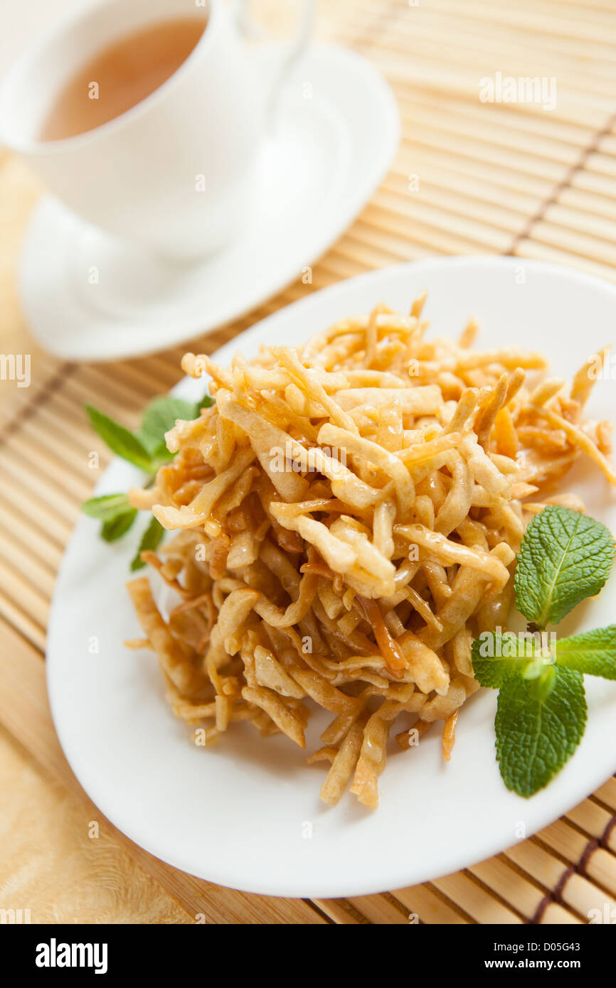 Honey chak-chak and a cup of fragrant tea, close up Stock Photo - Alamy