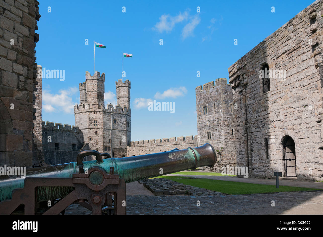 Wales, County Gwynedd, Caernarfon Castle, Welsh flags atop Eagle Tower ...
