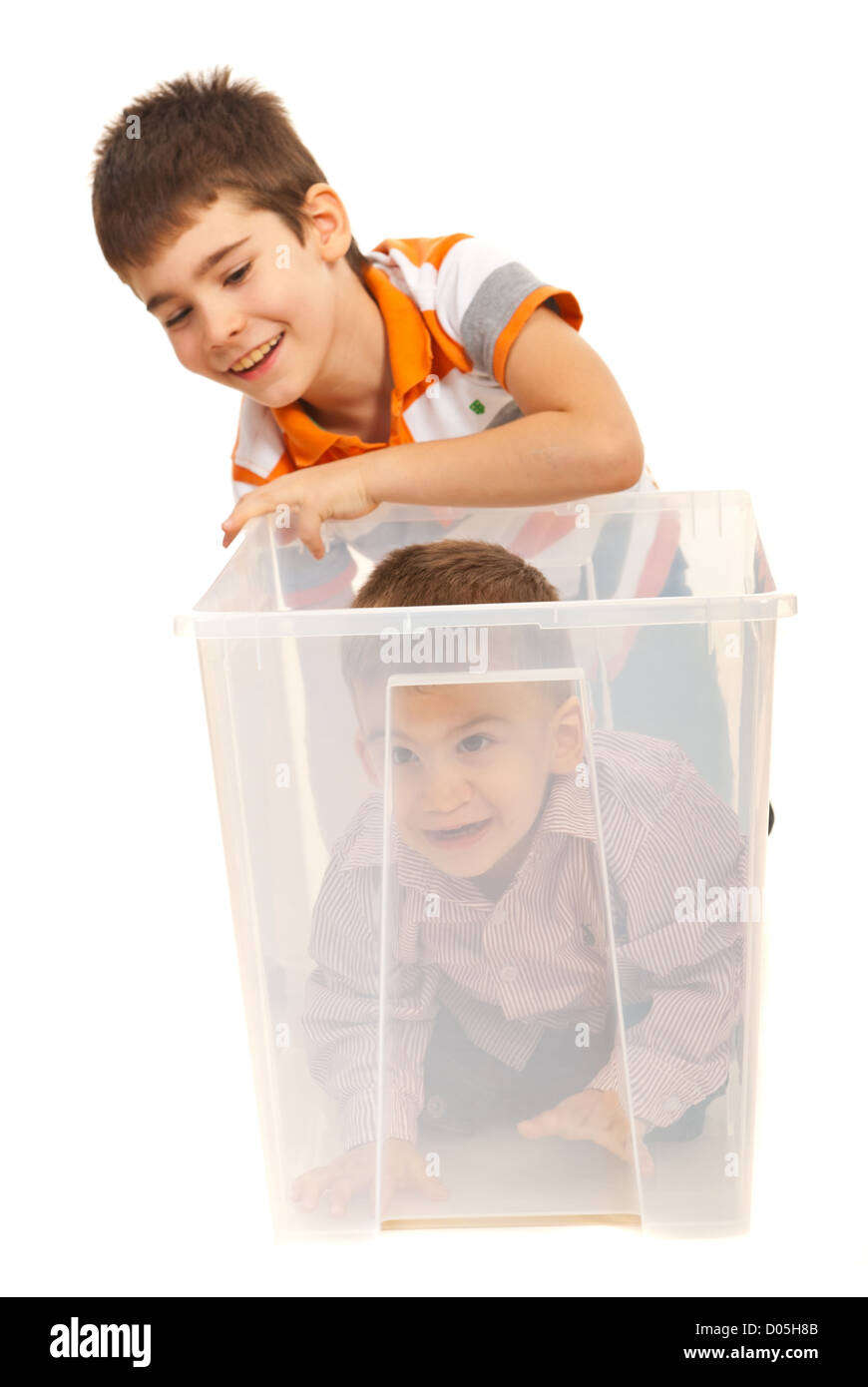 Big brother laughing while his little bro being in a transparent box ...