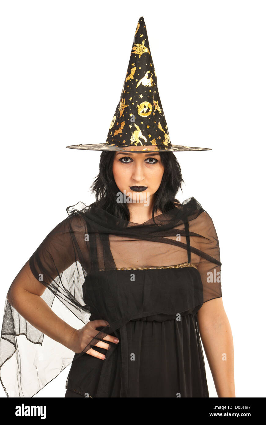 Elegant witch with hat posing isolated on white background Stock Photo ...
