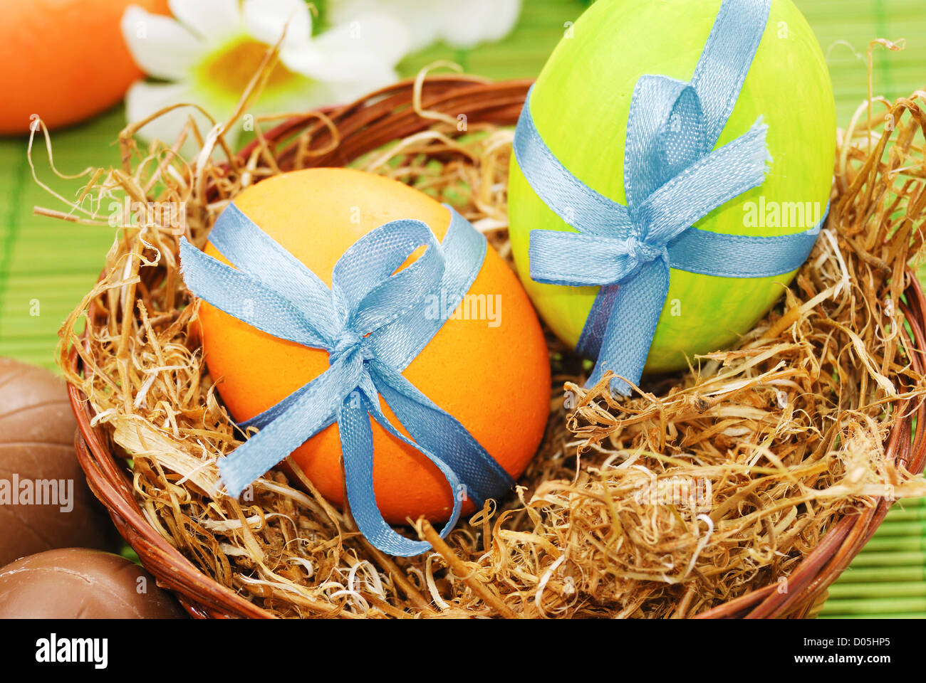 Colorful easter eggs in the basket Stock Photo - Alamy