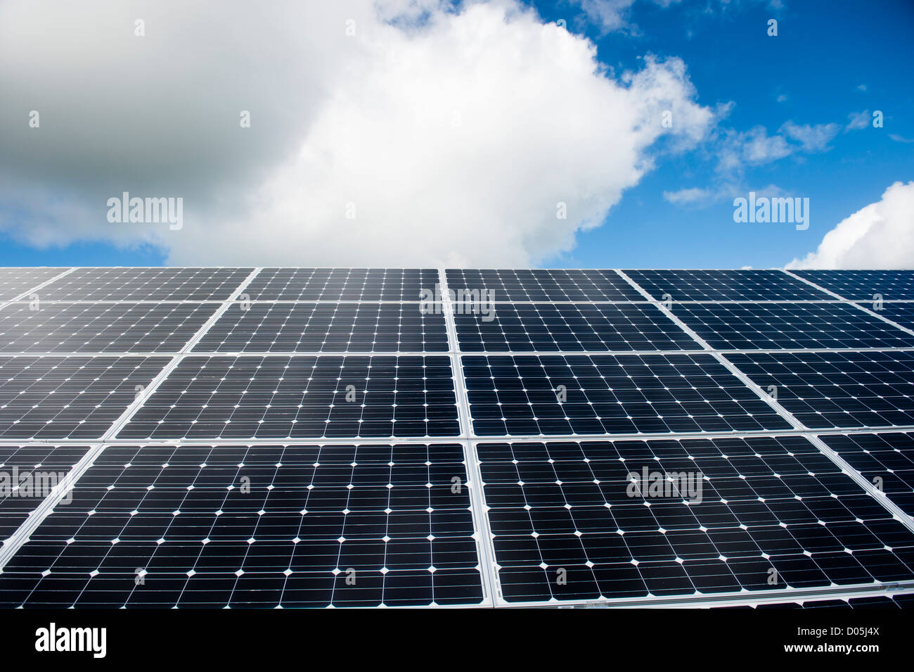Green renewable energy: An array of solar panels converting sunshine ... Green renewable energy: An array of solar panels converting sunshine ...