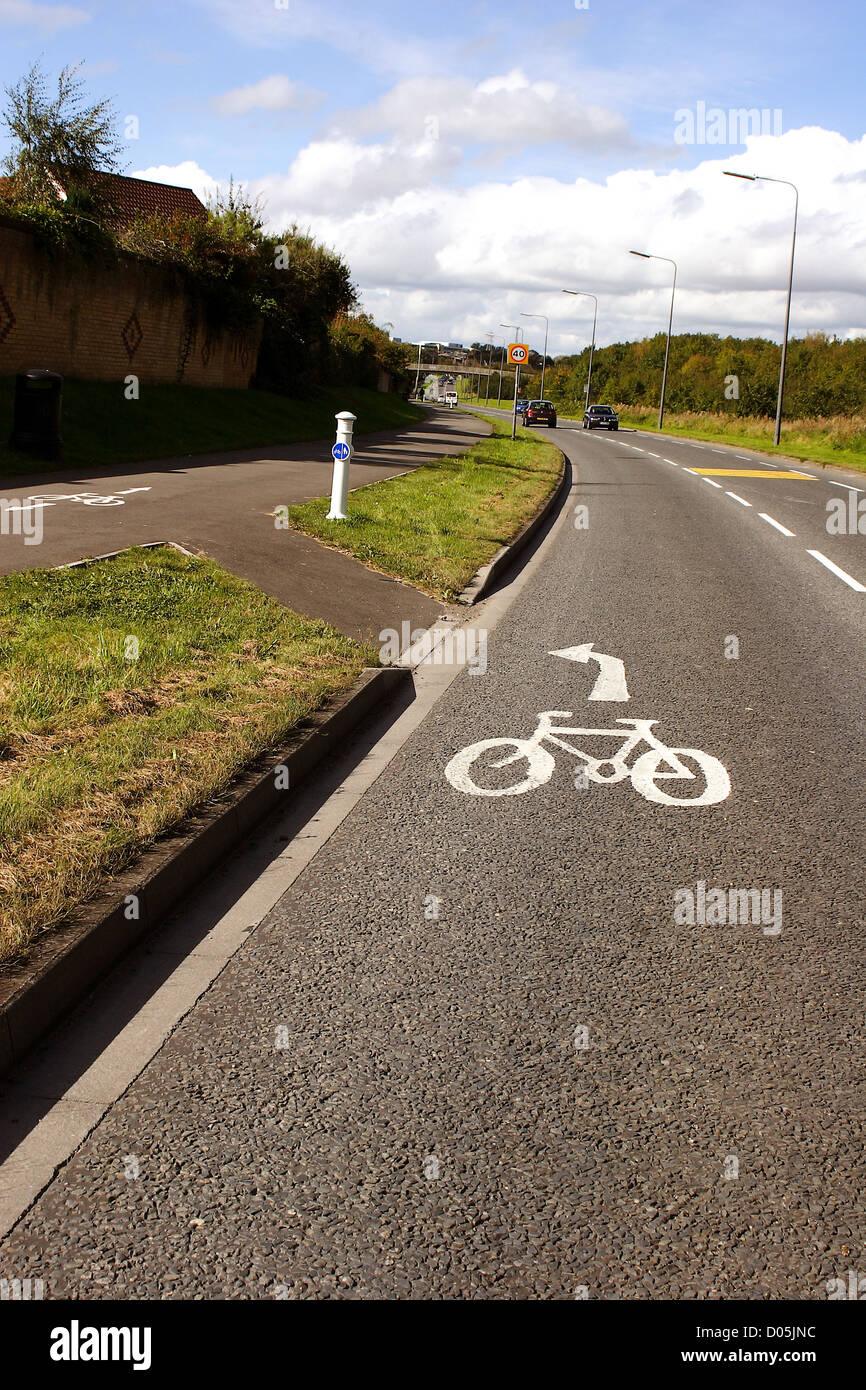 Direction sign painted in the road for cyclists to move on to a ...